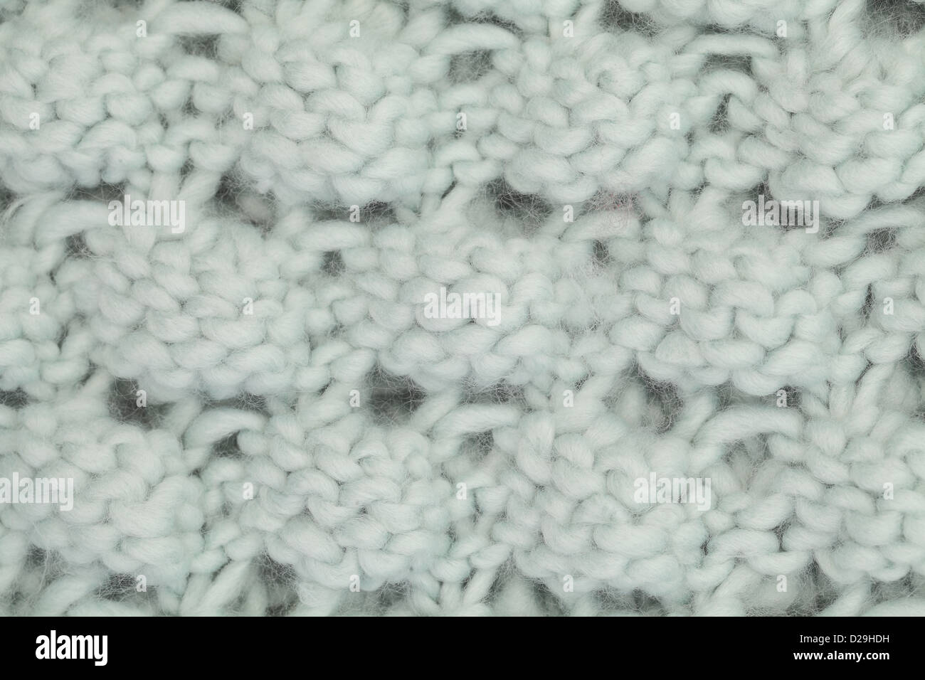 Close-up photo of knitting of pale green yarn Stock Photo - Alamy