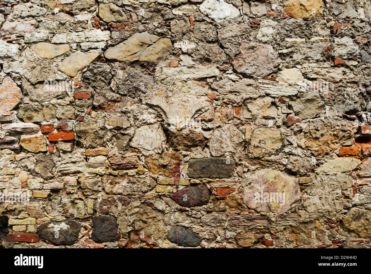 Ancient stone wall. Fragment of an ancient wall from a cobble-stone ...
