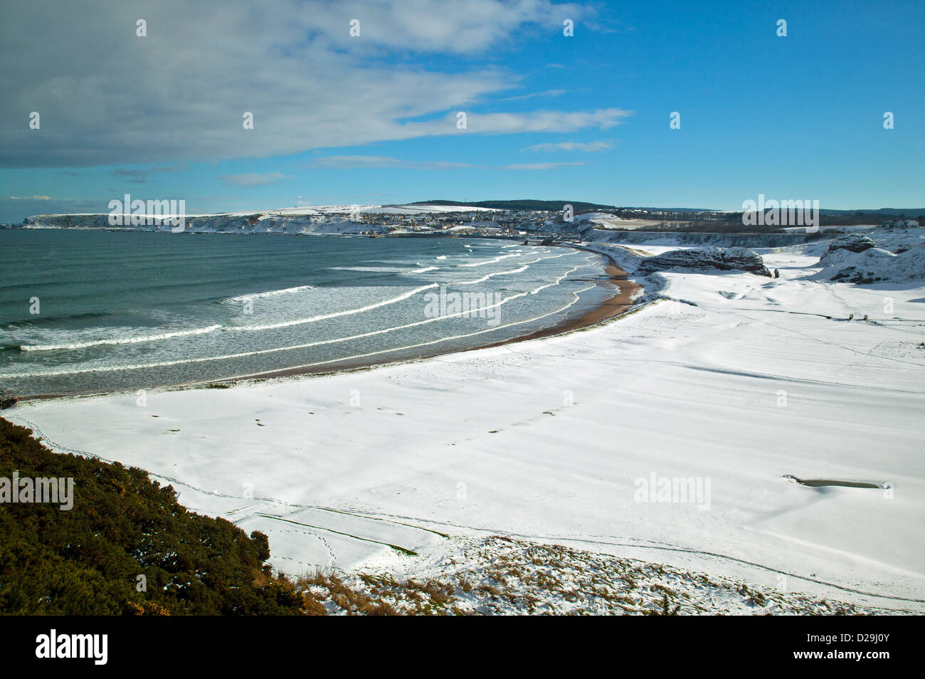WINTER SNOW LIES ON THE BEACH AND GOLF COURSE AT CULLEN BAY WITH THE ...