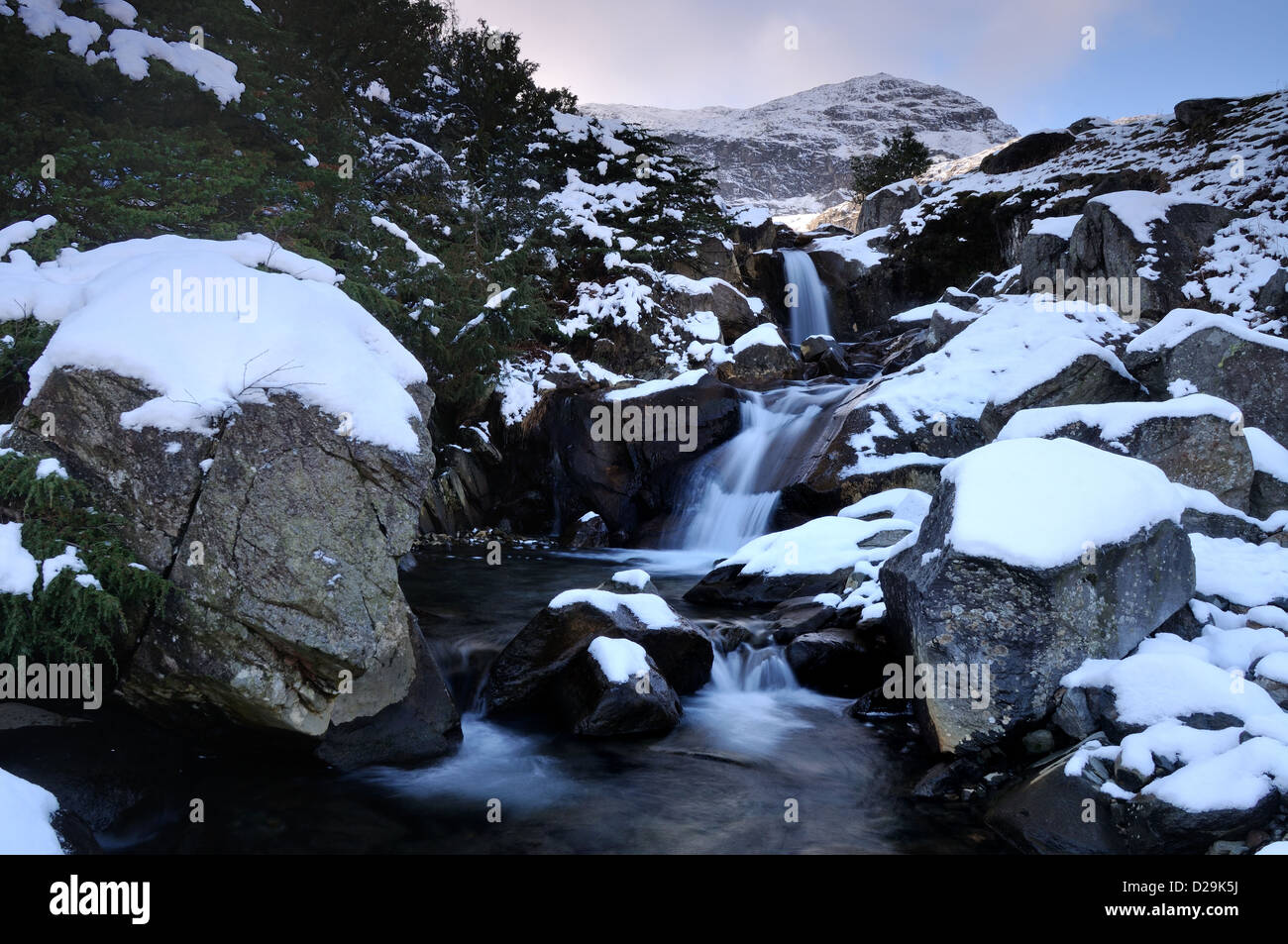 Waterfalls on Levers Water Beck in winter with the Old Man of Coniston ...