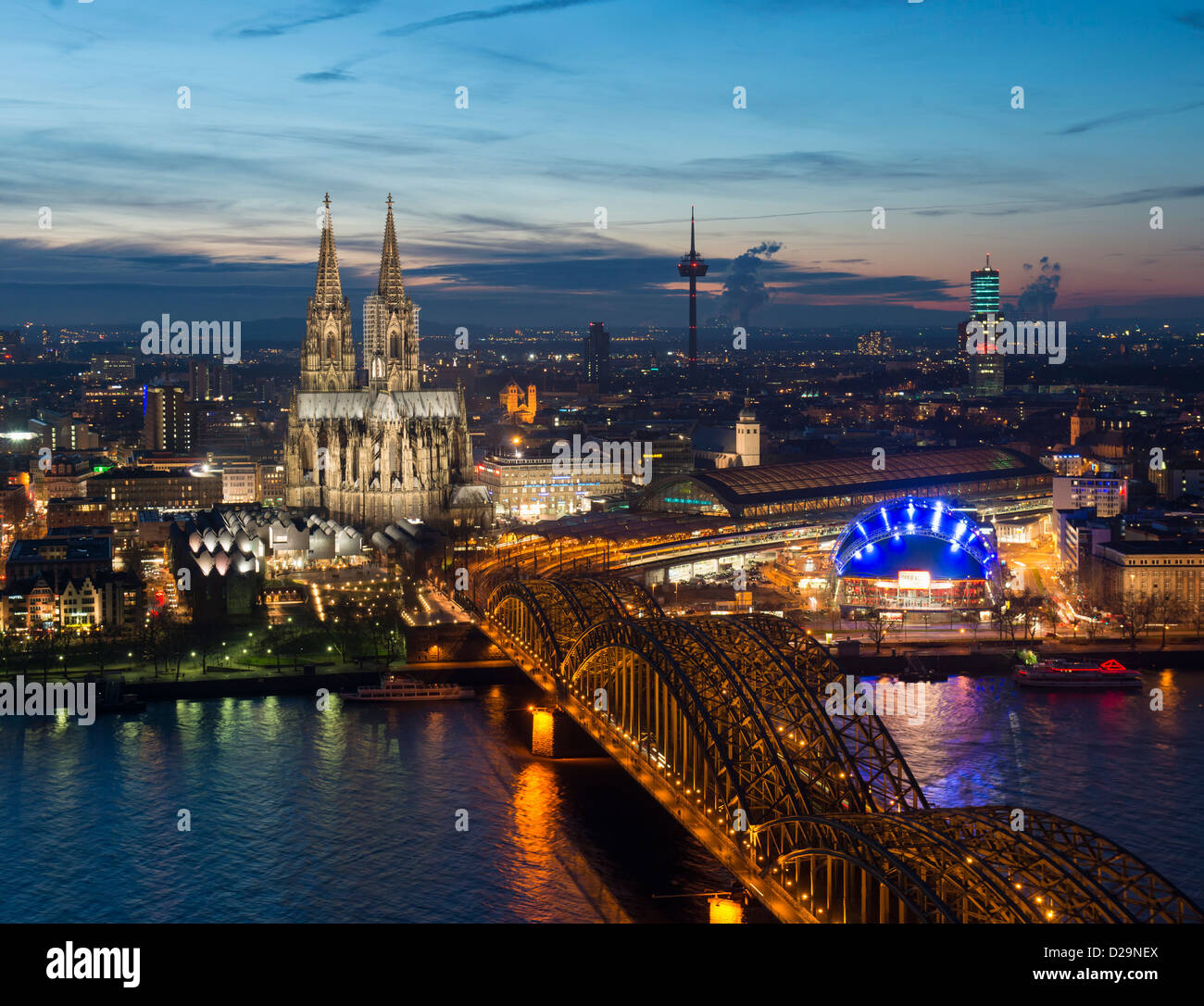 Evening view of skyline of Cologne, Germany with floodlit Cathedral ...