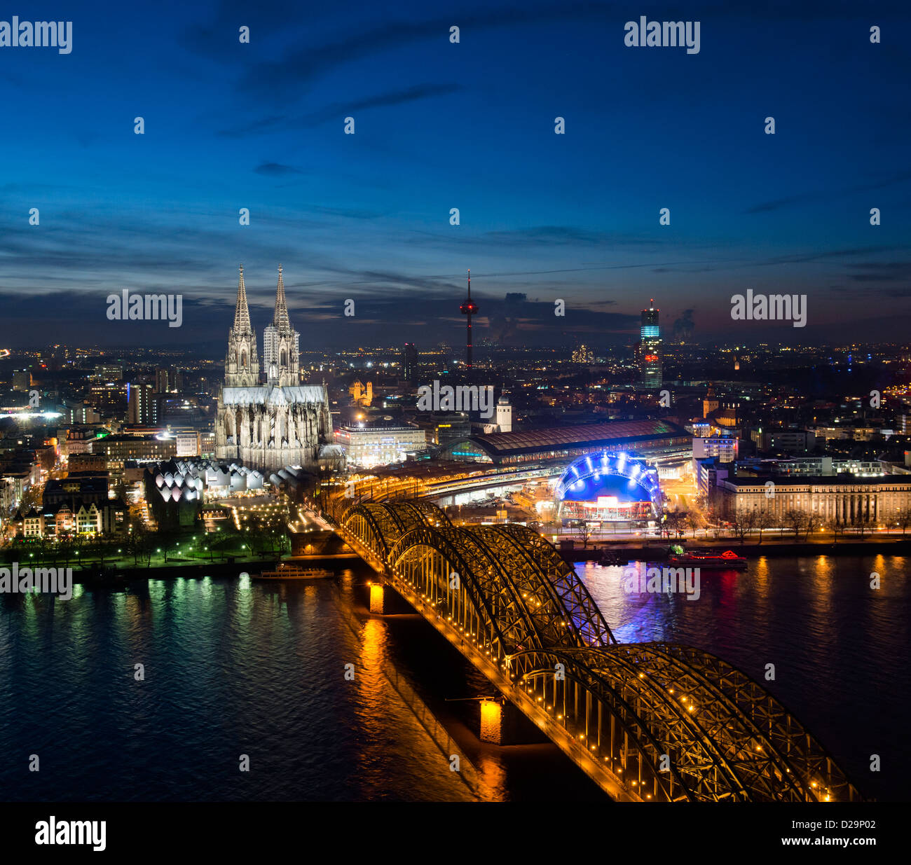 Evening view of skyline of Cologne, Germany with floodlit Cathedral ...