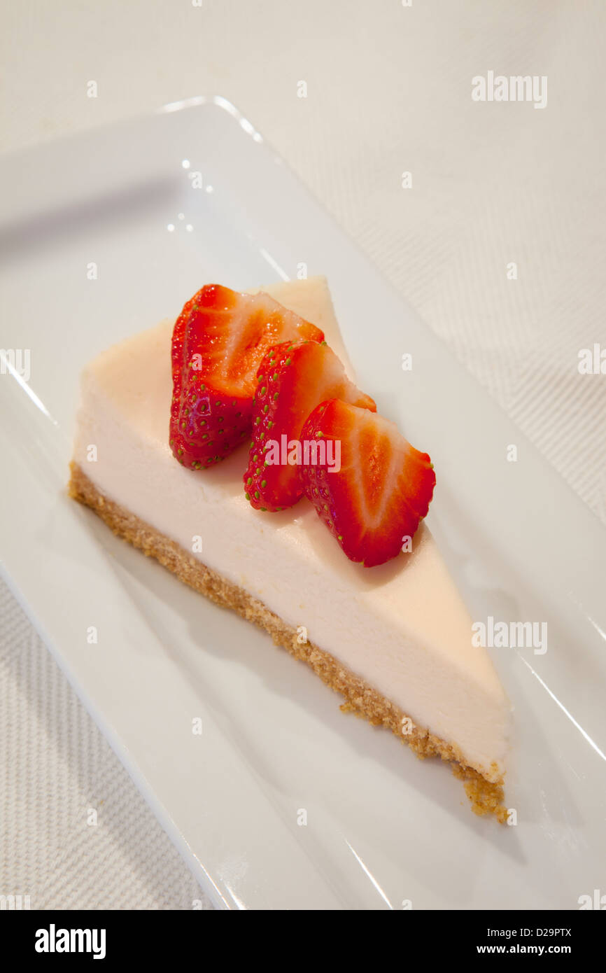 Strawberry topped Cheesecake on a rectangular plate Stock Photo - Alamy