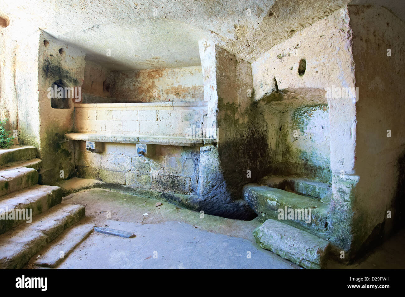 Interior of an ancient cave dwelling, known as a “ Sassi “ , in Matera ...
