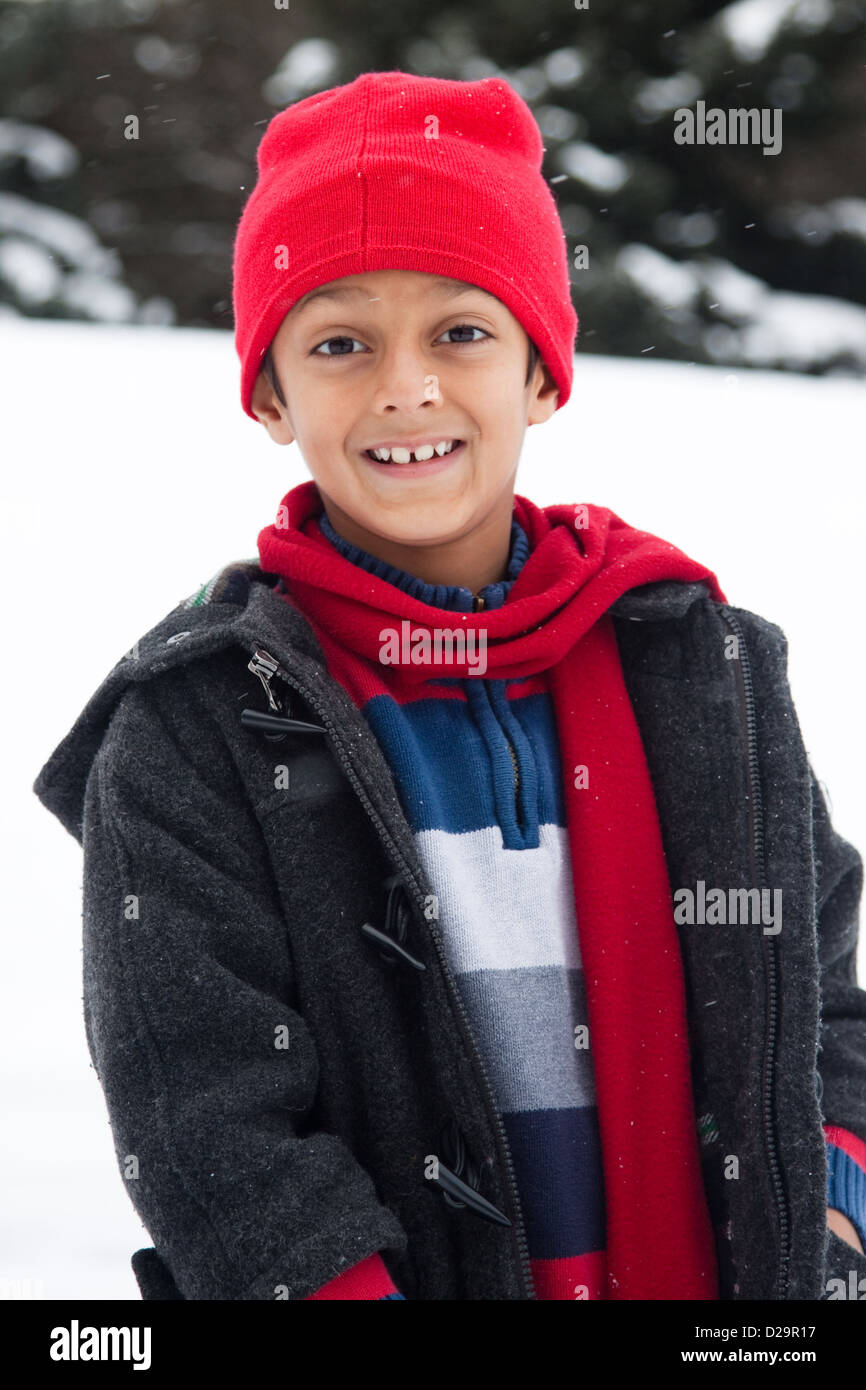 A cute East Indian boy child enjoying the snowfall Stock Photo - Alamy