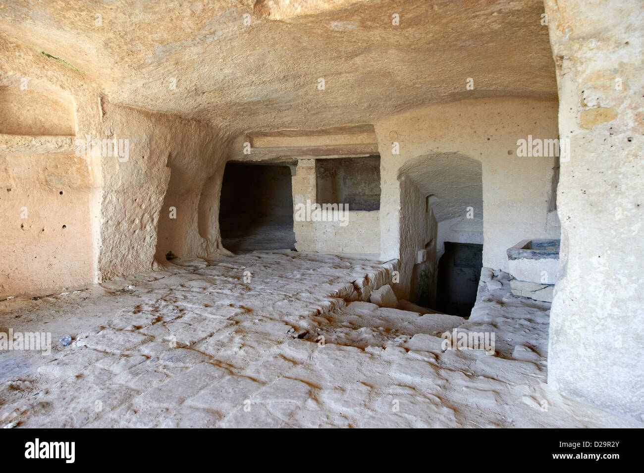 Interior of an ancient cave dwelling, known as a “ Sassi “ , in Matera ...