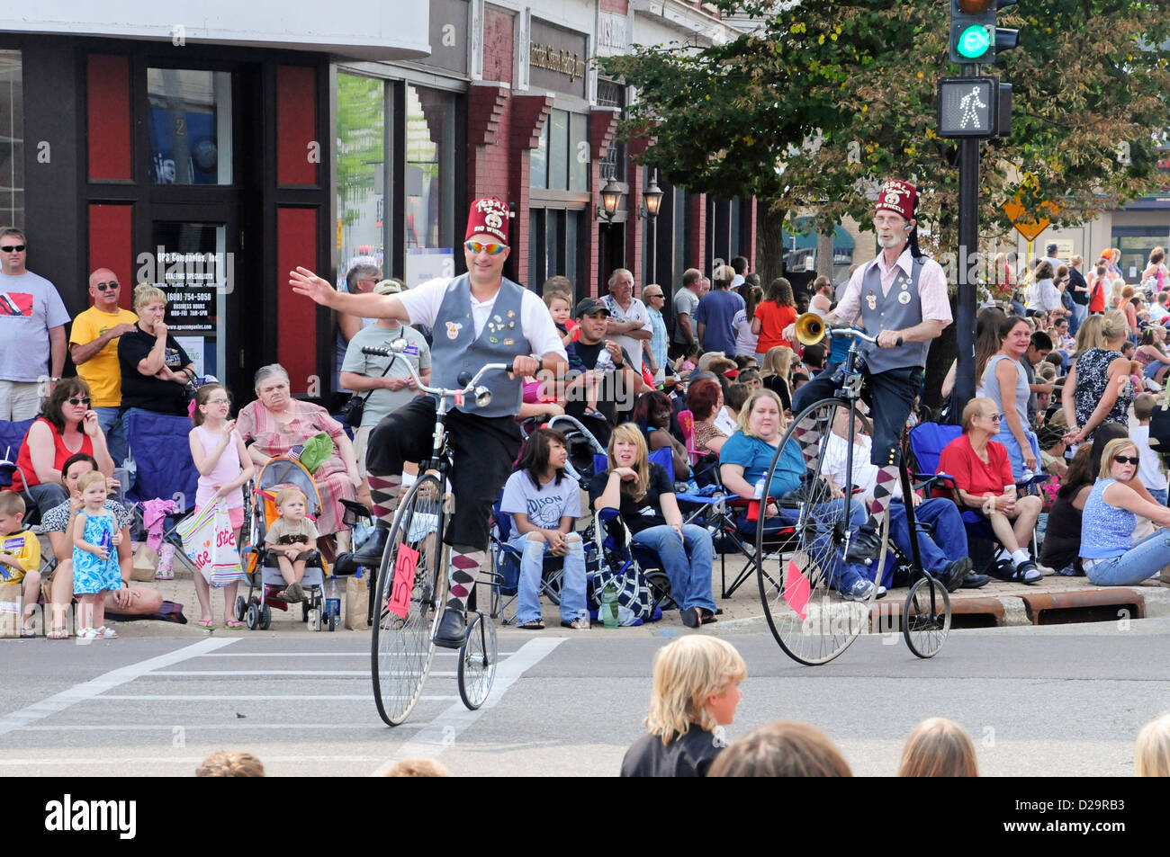 Big Wheel Cyclists In Parade, Janesville, Wisconsin Stock Photo - Alamy