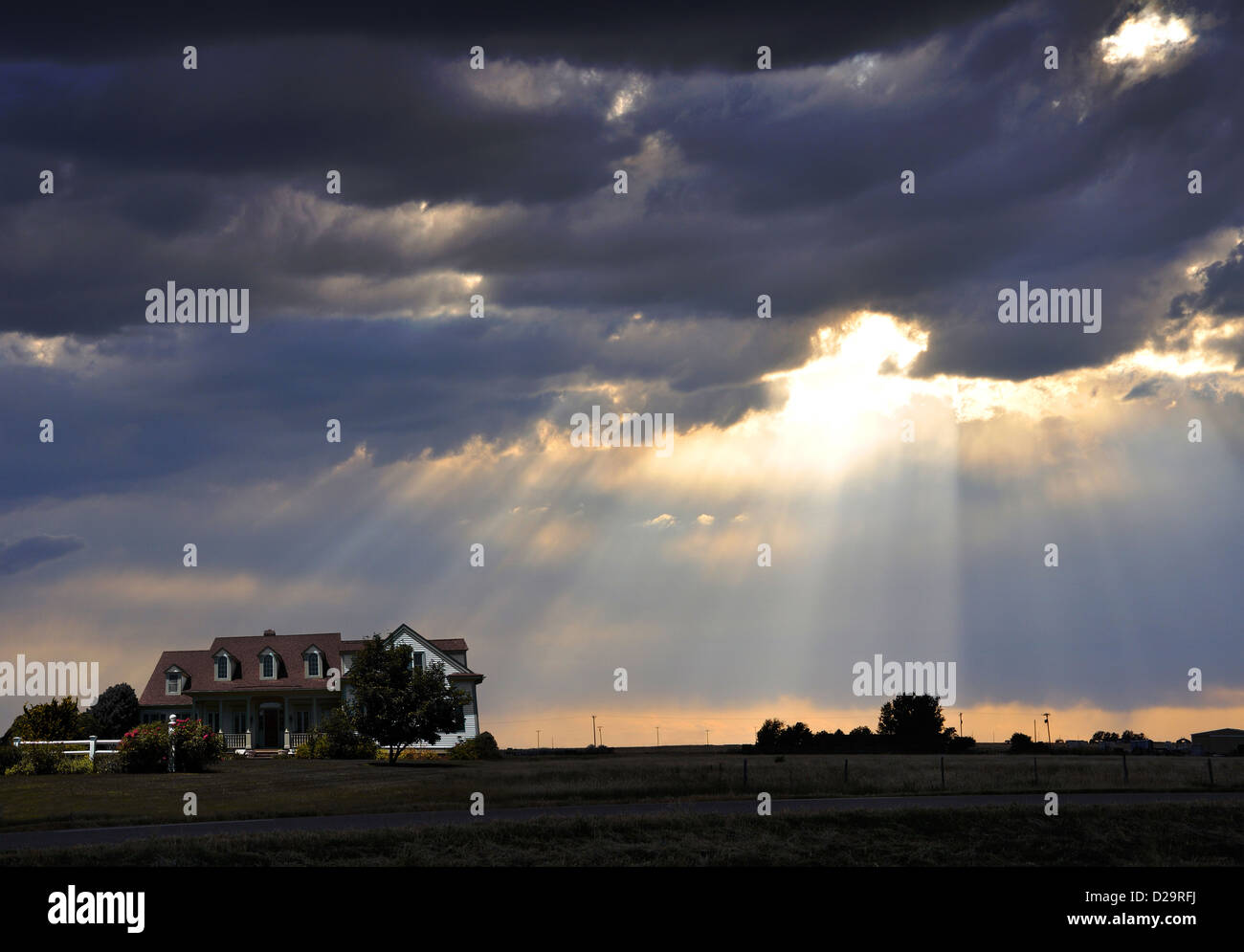 House and approaching storm Stock Photo - Alamy