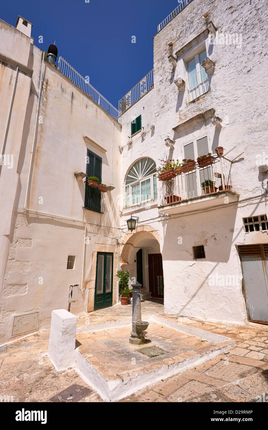 The medieval narrow streets of Ostuni, The White Town, Puglia, Italy ...