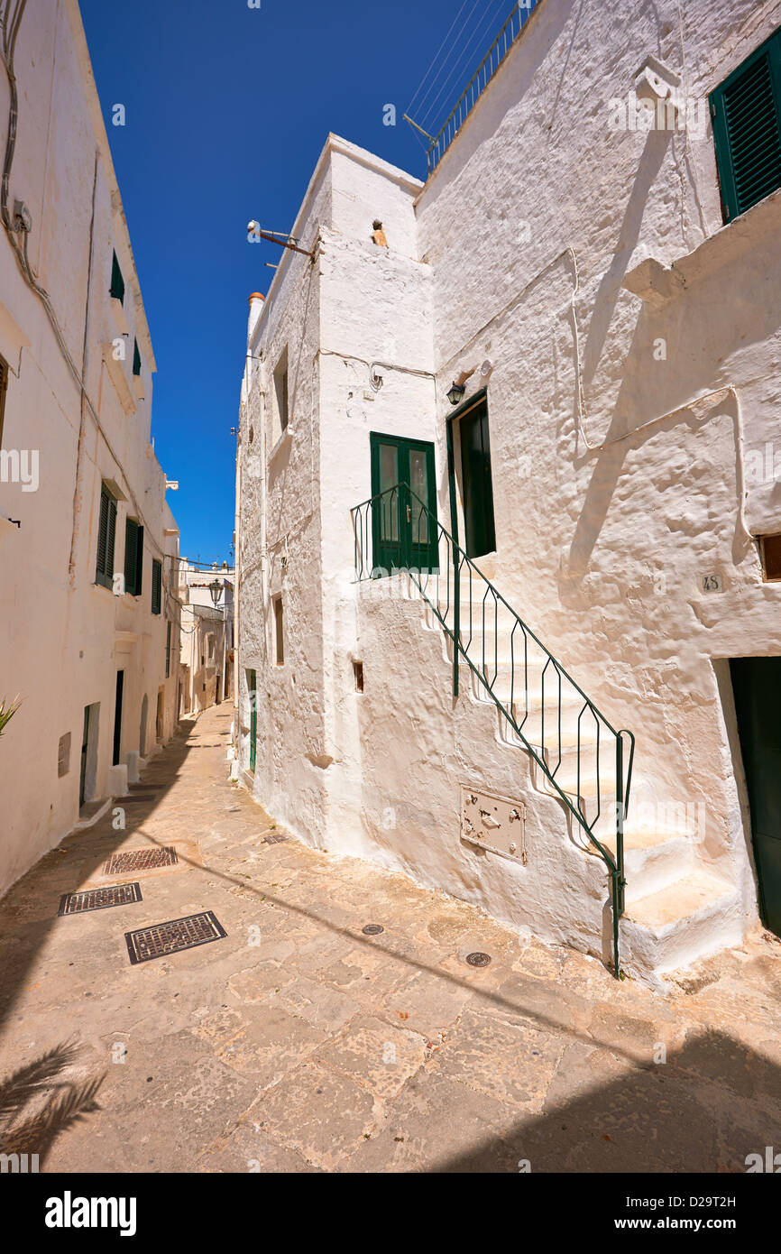 The medieval narrow streets of Ostuni, The White Town, Puglia, Italy ...