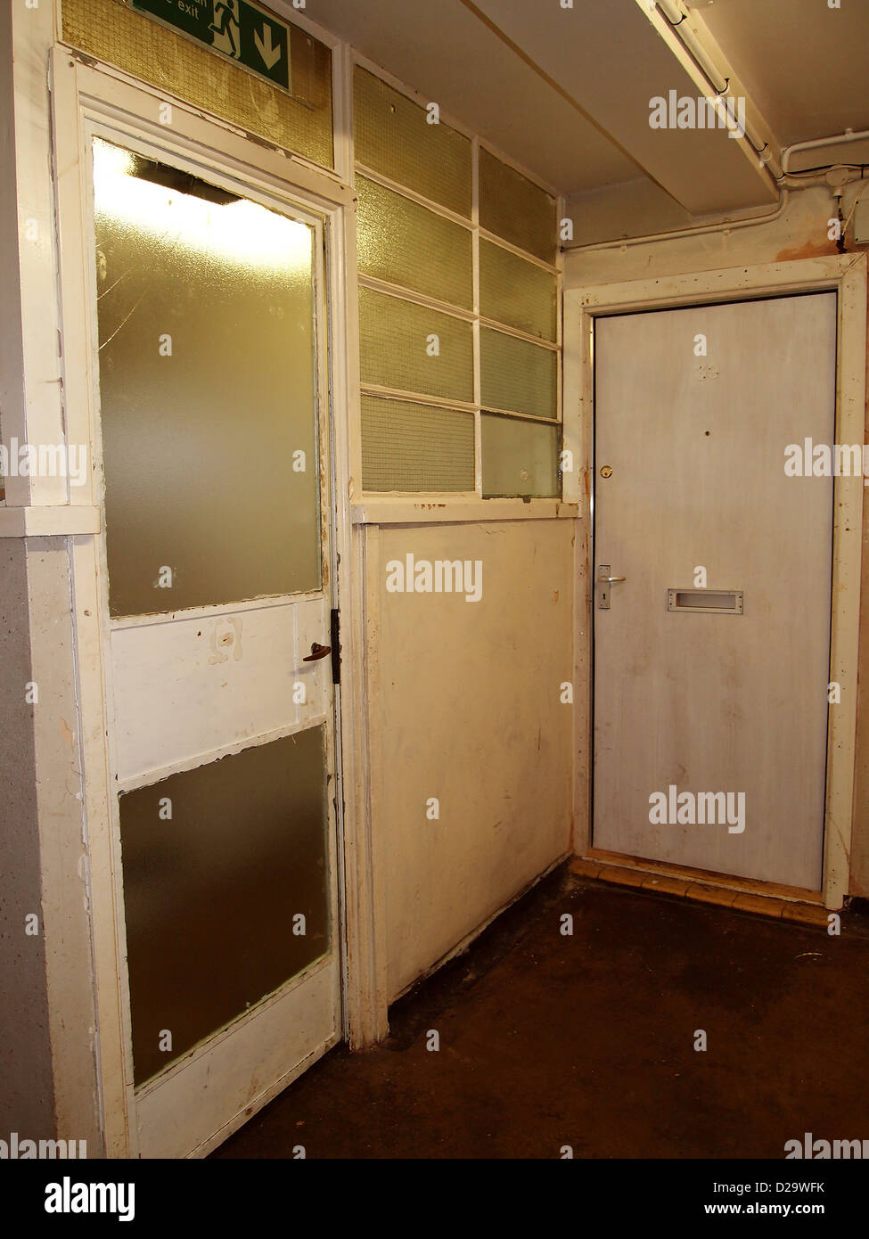 Communal shared staircase door with an adjacent apartment door Stock ...