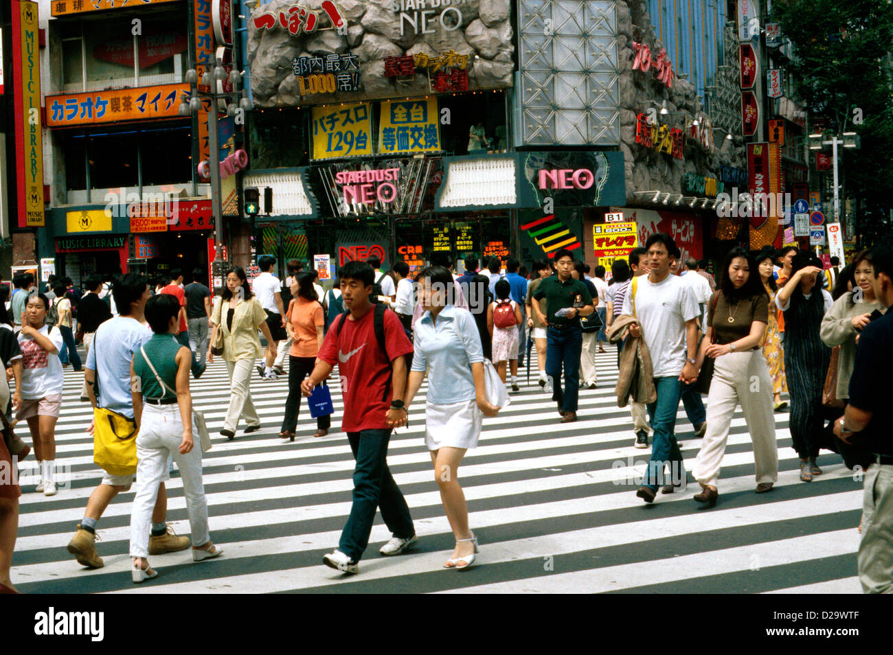 Japan, Tokyo, Shinjuku Section. Pedestrians Walking In Street Stock ...