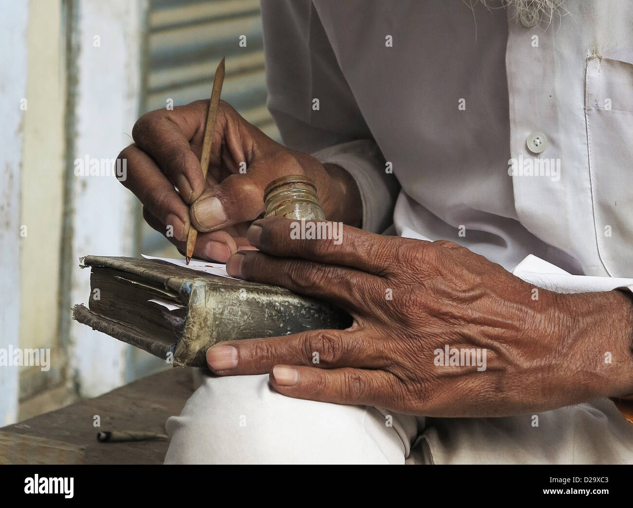 Detail of the hands of a writing man in Rajasthan, India Stock Photo ...