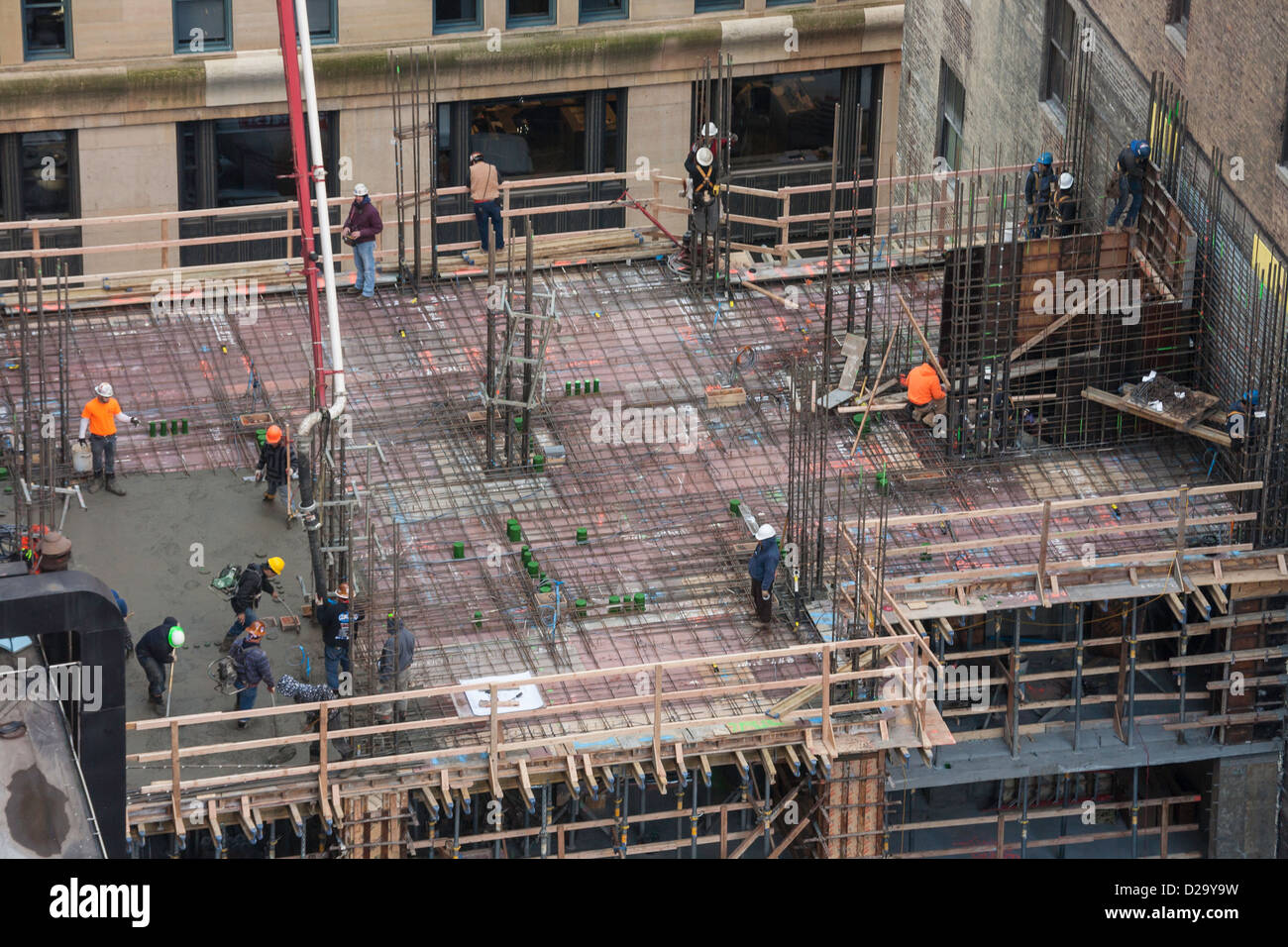 High-rise Building Construction Site with tradesmen (1 of 3 Stock Photo ...