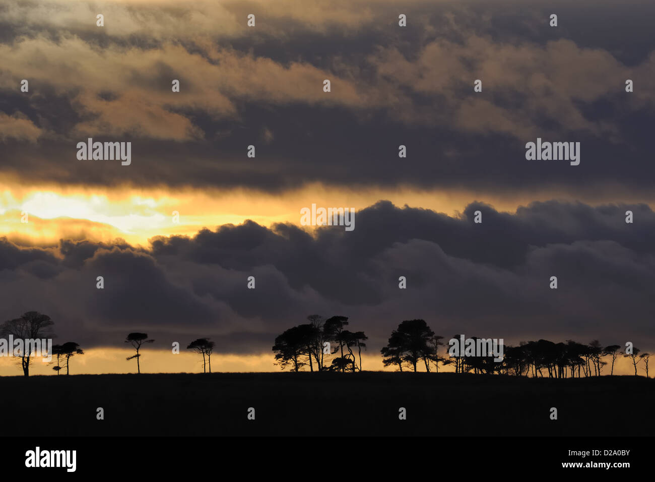 Sun setting on the moors above Glasgow highlighting a weather front ...