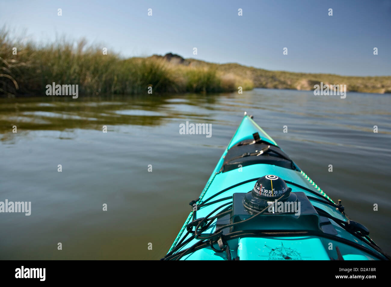 Kayak traveling through Saguaro Lake in Arizona Stock Photo - Alamy