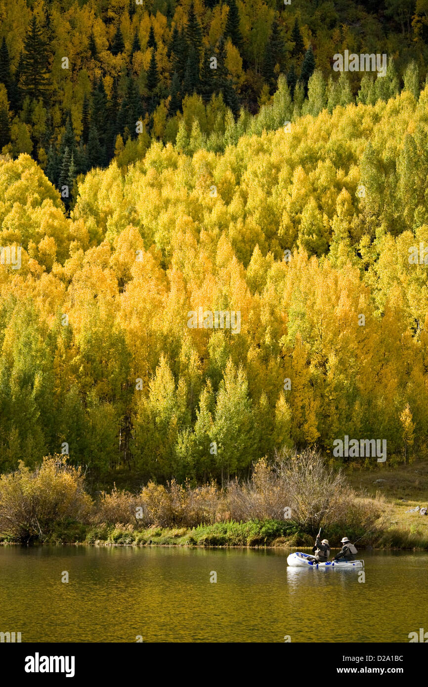 Two adult men fishing in Crystal Lake in autumn near Ouray, Colorado ...