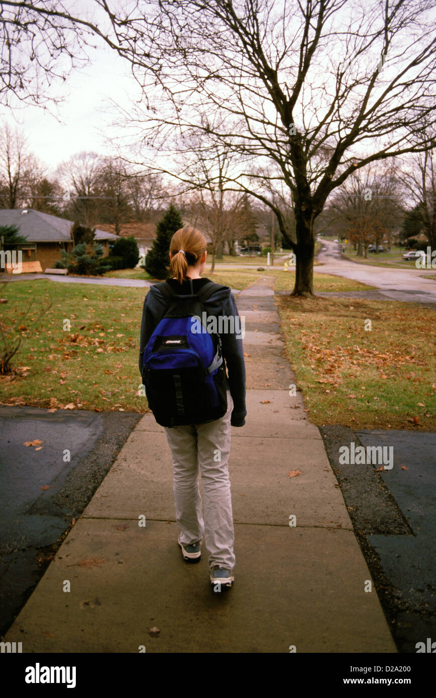 Illinois. 12 Year Old Girl Wearing Backpack Walking To School Stock ...