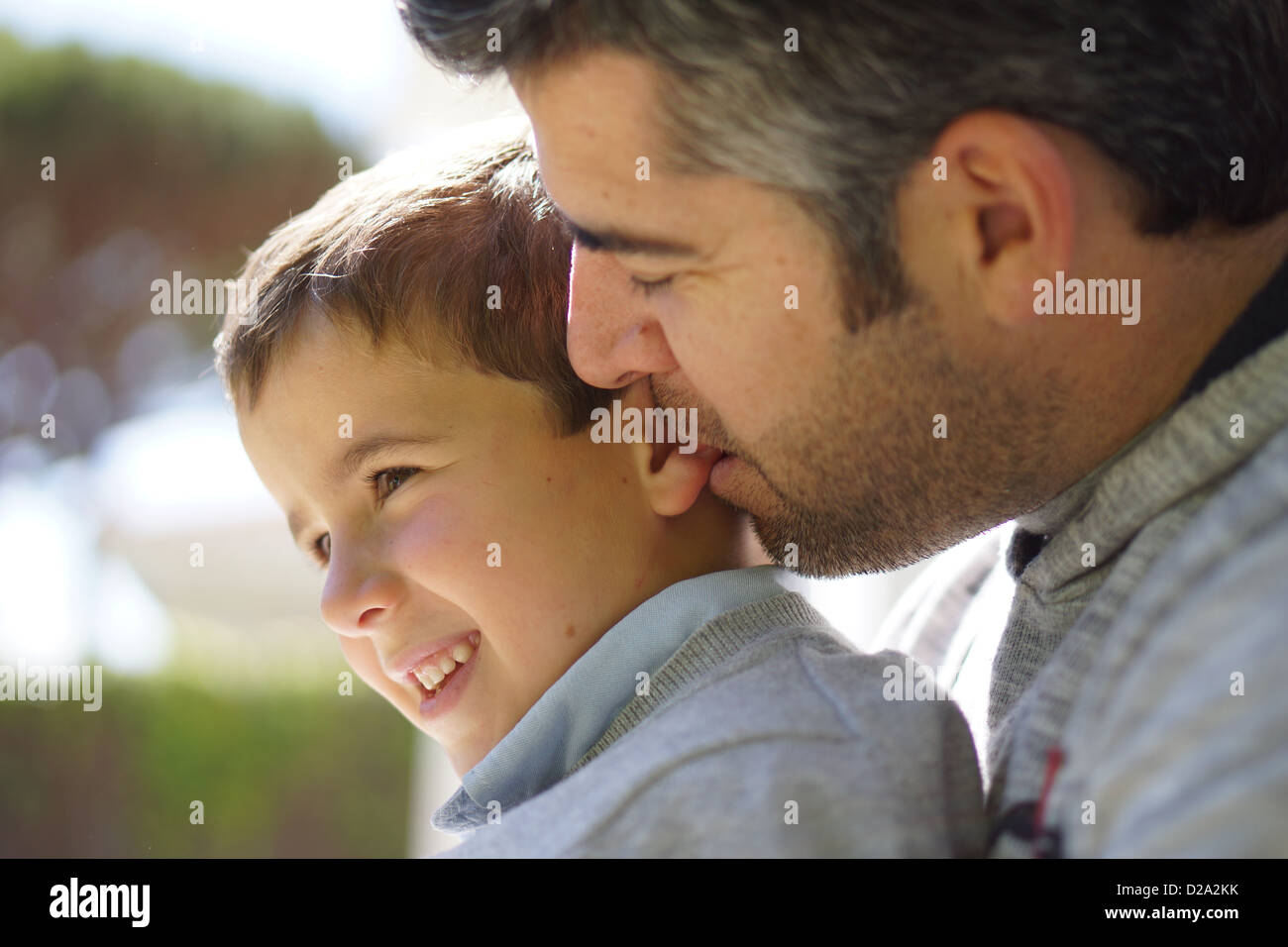 boy father kiss smile dad child children portrait Stock Photo - Alamy