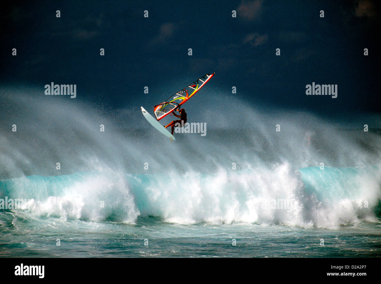 Hawaii, Maui. Windsurfer Launches Off A Wave At Hookipa Stock Photo - Alamy