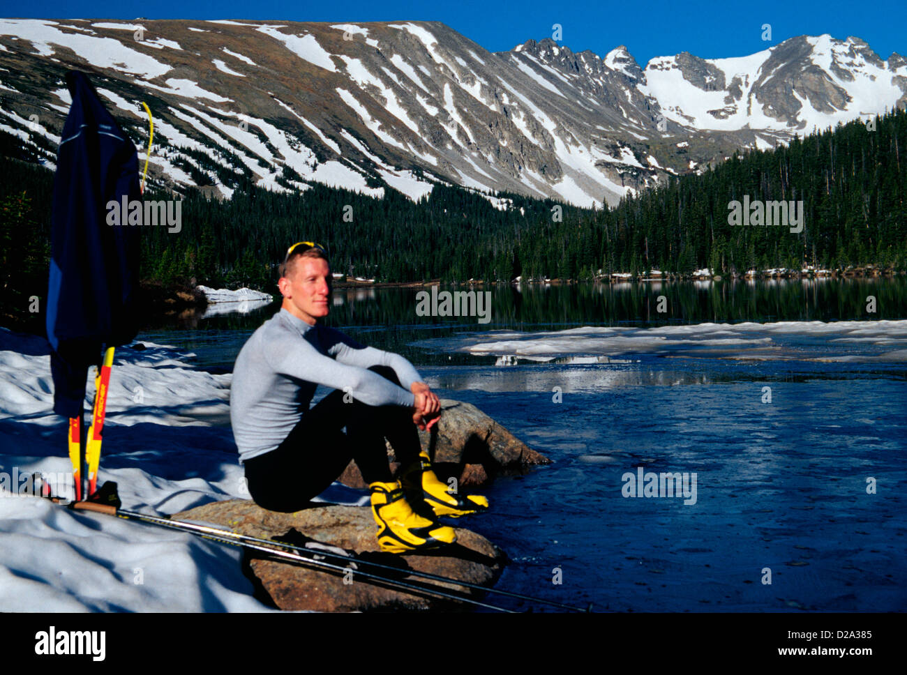Colorado, Indian Peaks Wilderness Area. Man Sitting Next To Lake Stock ...