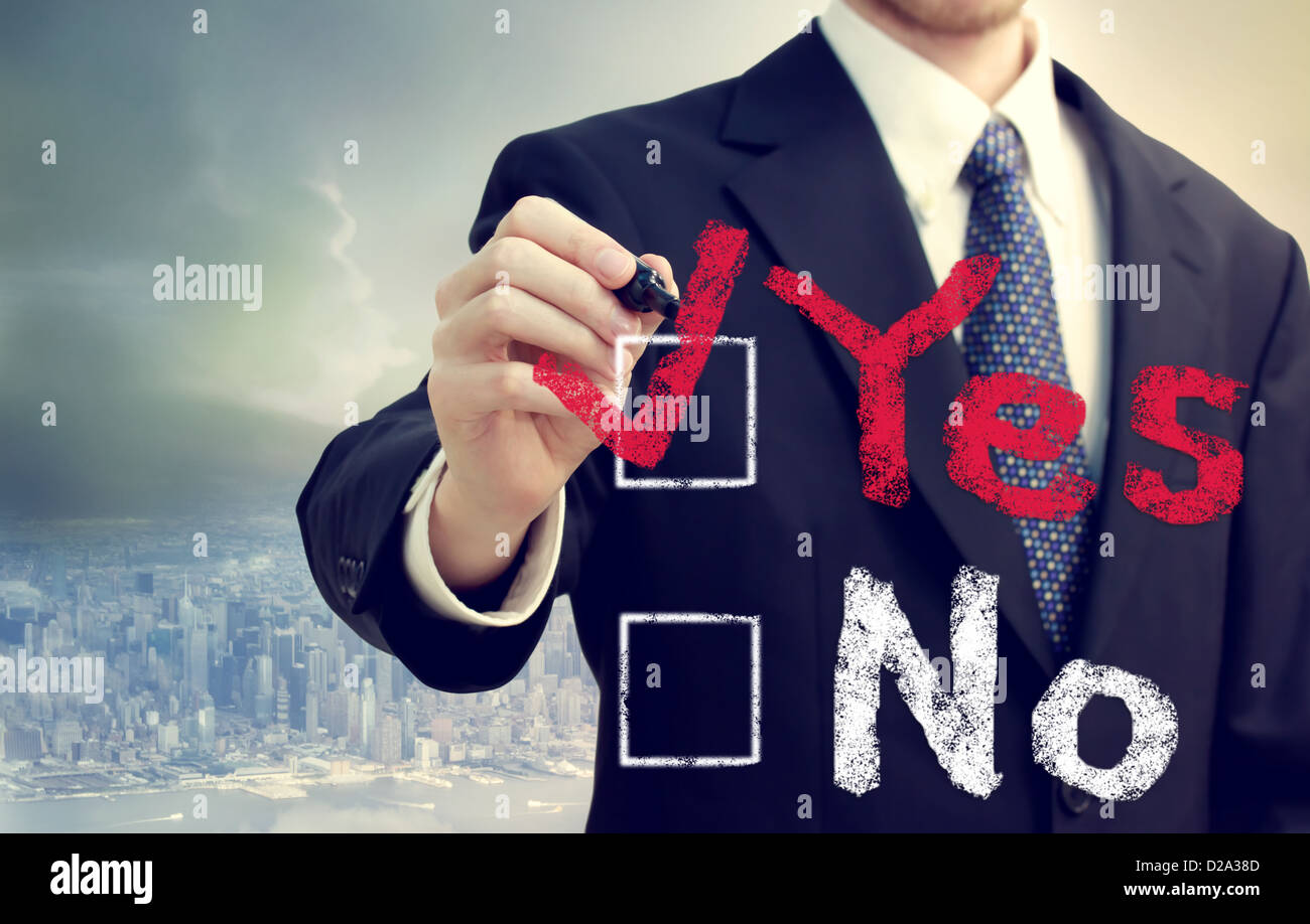 Man Checking the Yes Box above the city Stock Photo - Alamy