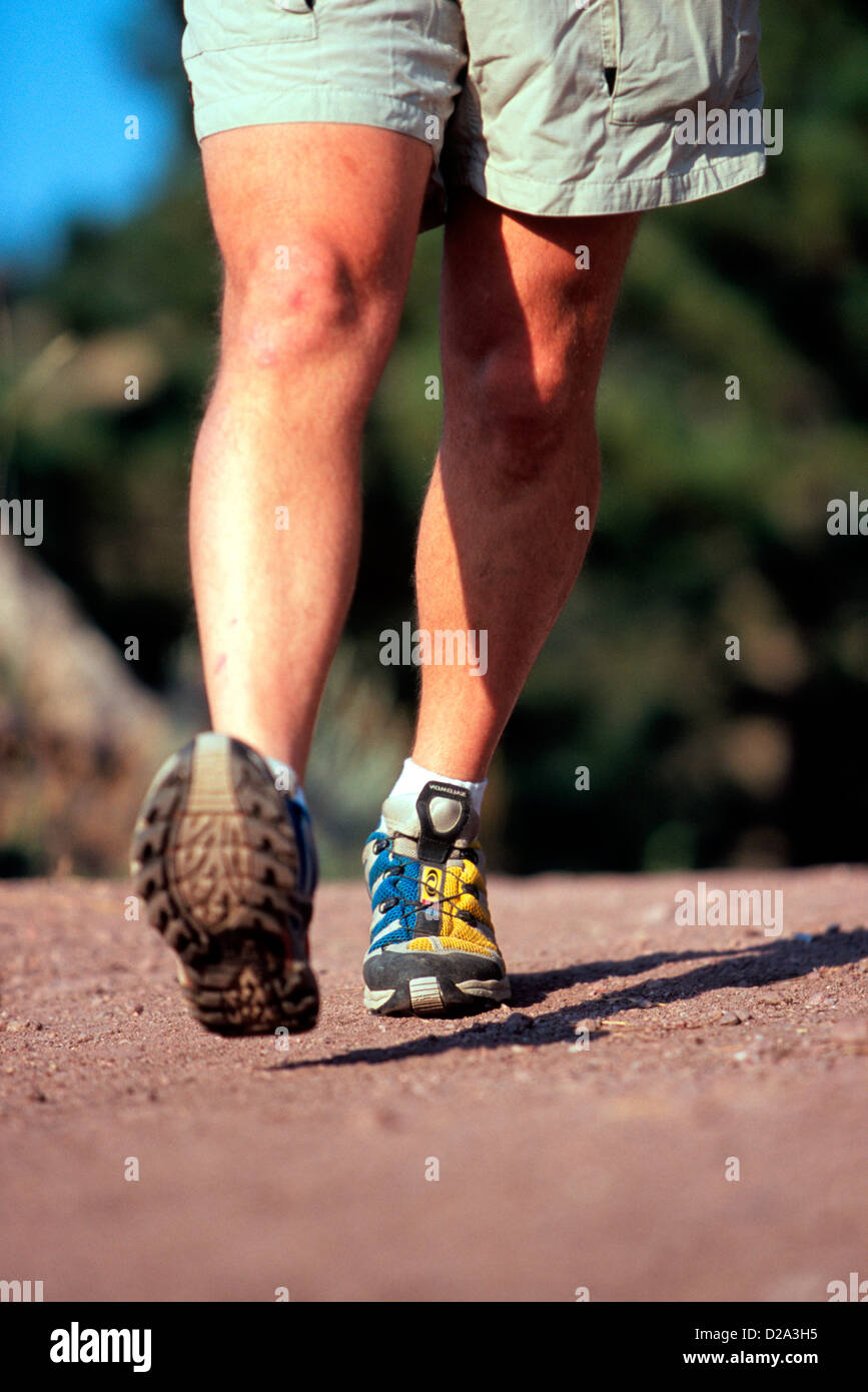 Close Up Of Man'S Legs And Feet Walking On A Dirt Trail Stock Photo - Alamy