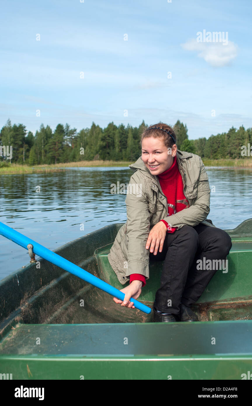 Woman, rowboat, lake, solitude hi-res stock photography and images - Alamy