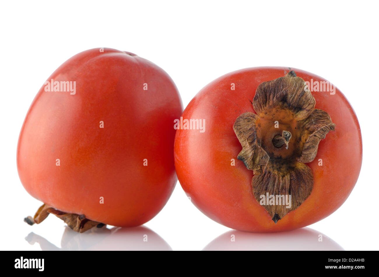 Red ripe persimmons isolated over white background Stock Photo - Alamy