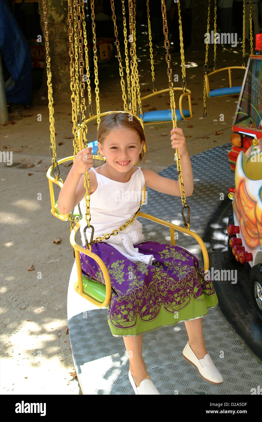Girl On Carousel Stock Photo - Alamy