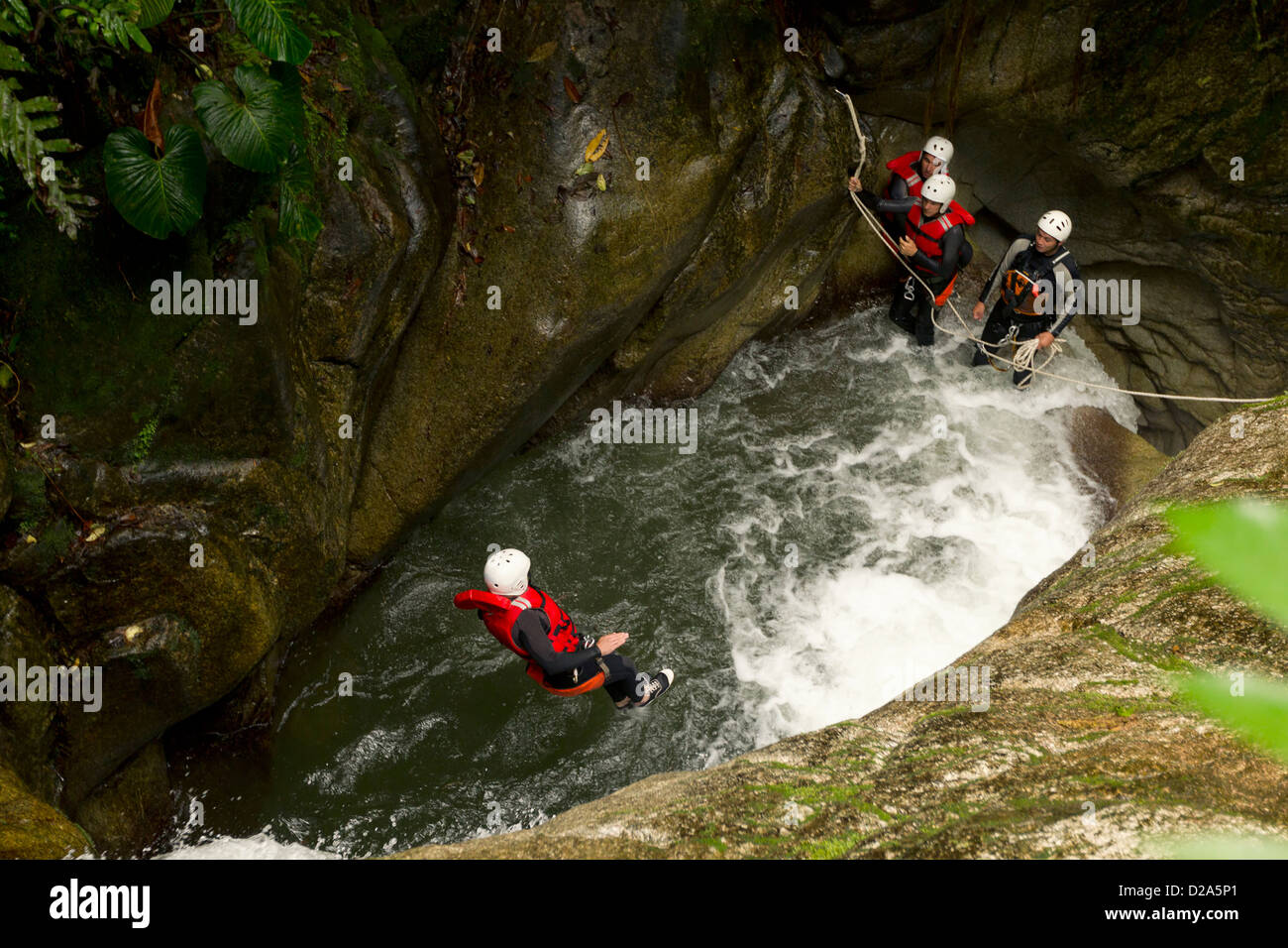 Well Equipped Man Jump Into A Nature Pool During A Canyoning Expedition ...
