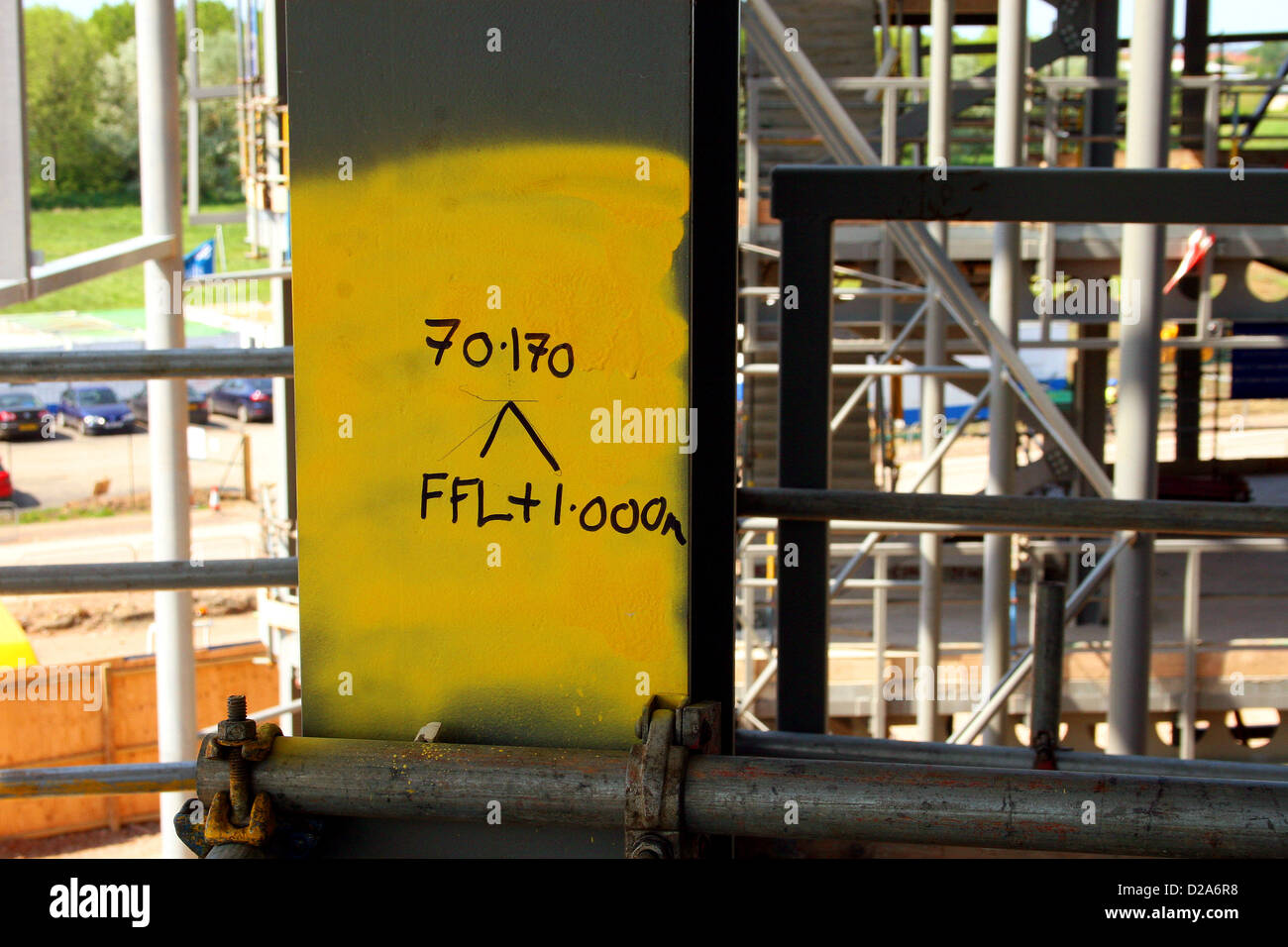 Construction engineers setting out mark to show how high the building ...