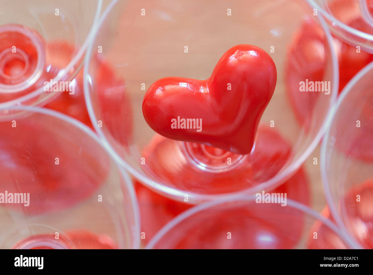 Small red heart stored in a glass Stock Photo - Alamy