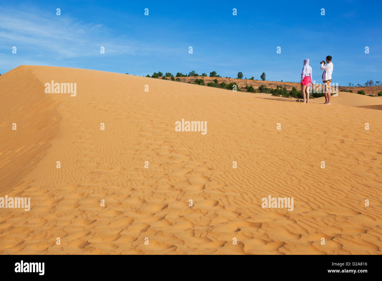 Vietnam, Mui Ne, Sand Dunes and Tourist Couple Stock Photo - Alamy