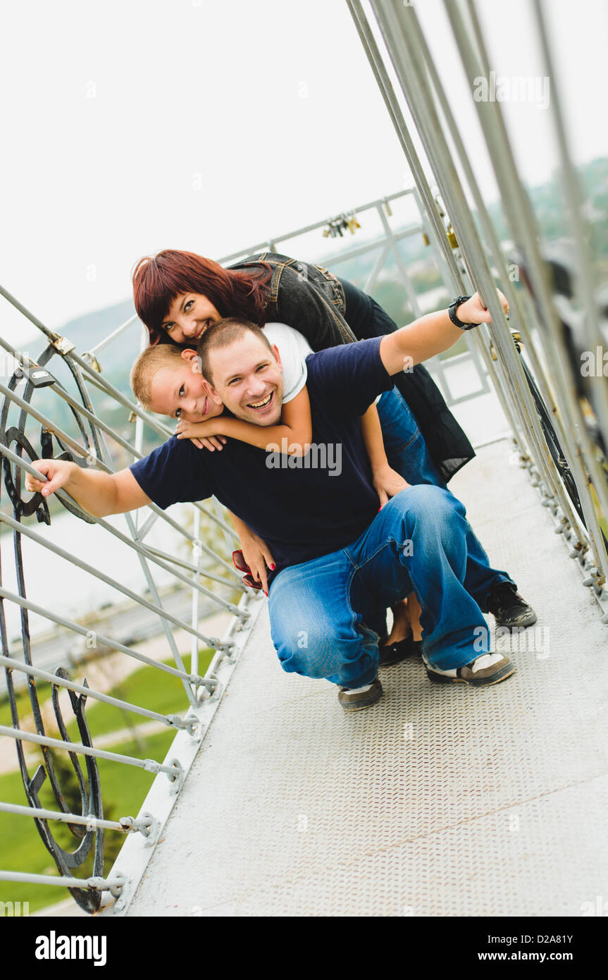 Young family play and smile each other in the park Stock Photo - Alamy