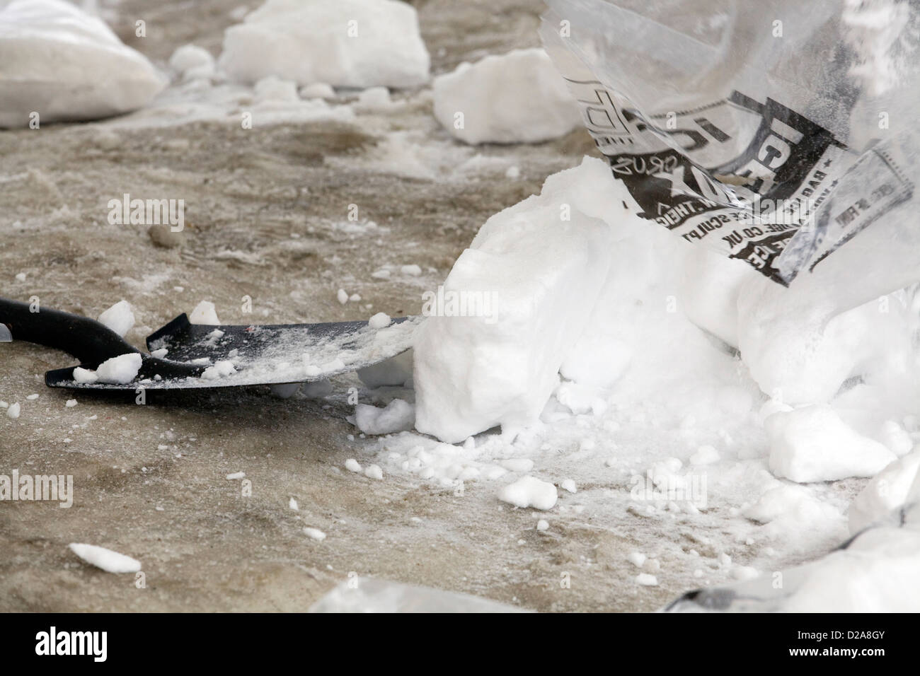 Play snow from ice block for a snow pit in London Stock Photo - Alamy