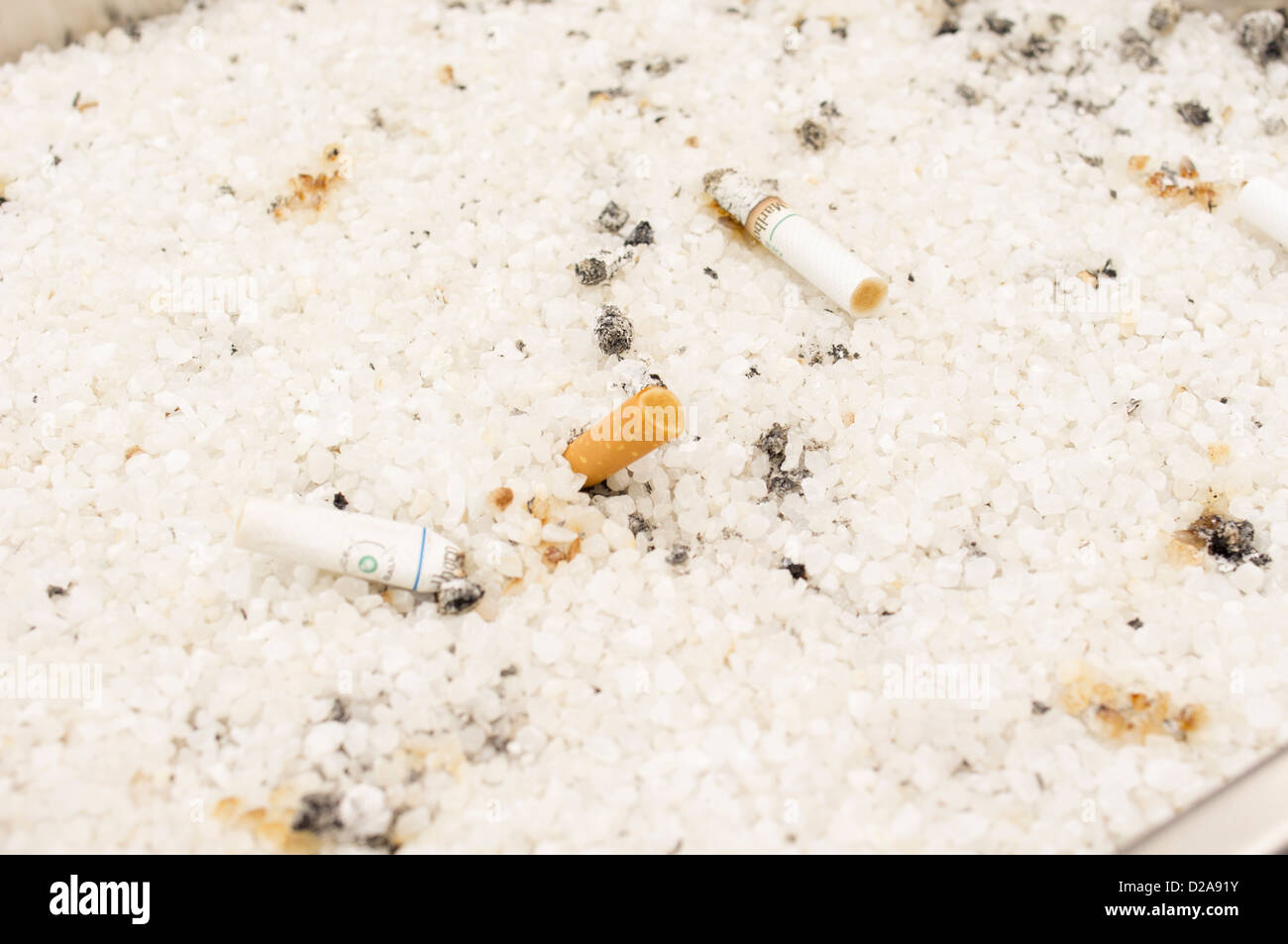 close up of cigarette butts in a smoking corner Stock Photo - Alamy