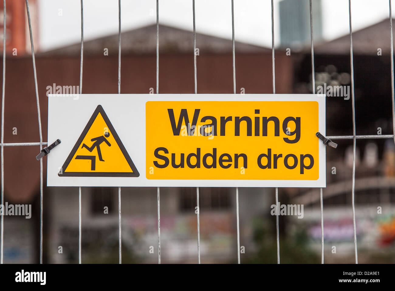 Warning, sudden drop sign, or wire security fence Stock Photo - Alamy