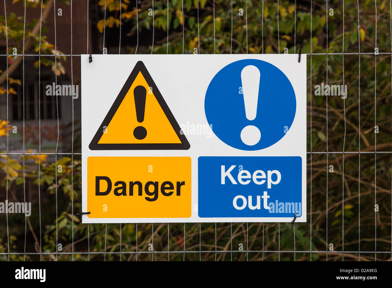Danger, keep out sign on wire security fence Stock Photo - Alamy