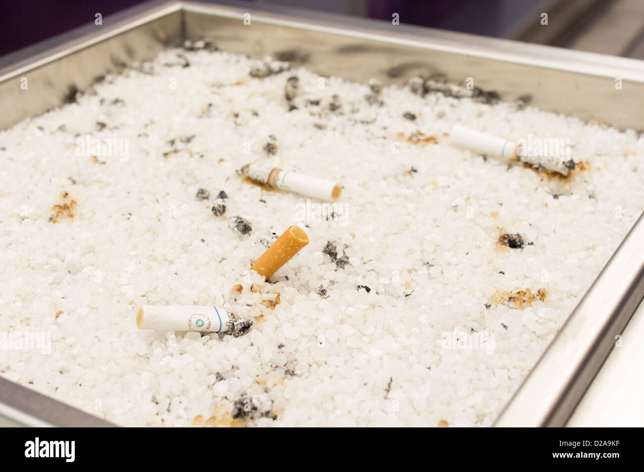 close up of cigarette butts in a smoking corner Stock Photo - Alamy