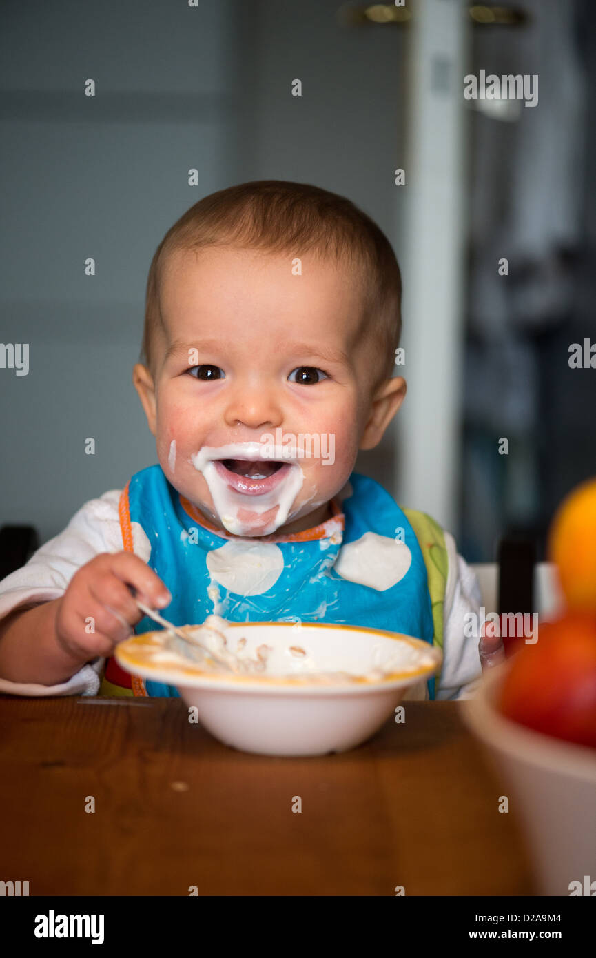 Berlin, Germany, a toddler with Schnute eating yoghurt Stock Photo - Alamy
