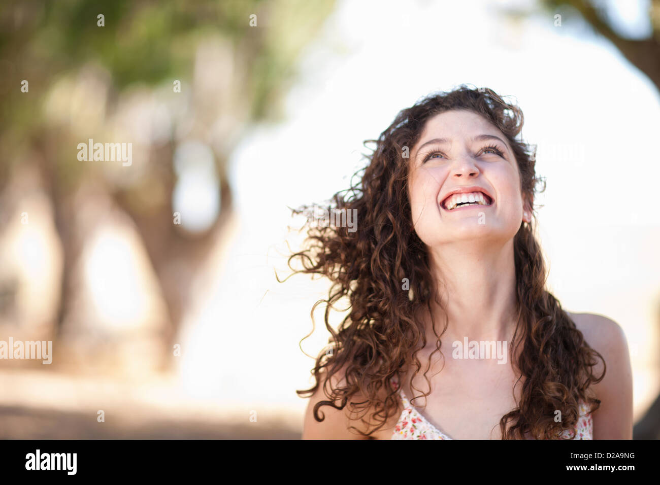 Smiling woman standing outdoors Stock Photo - Alamy