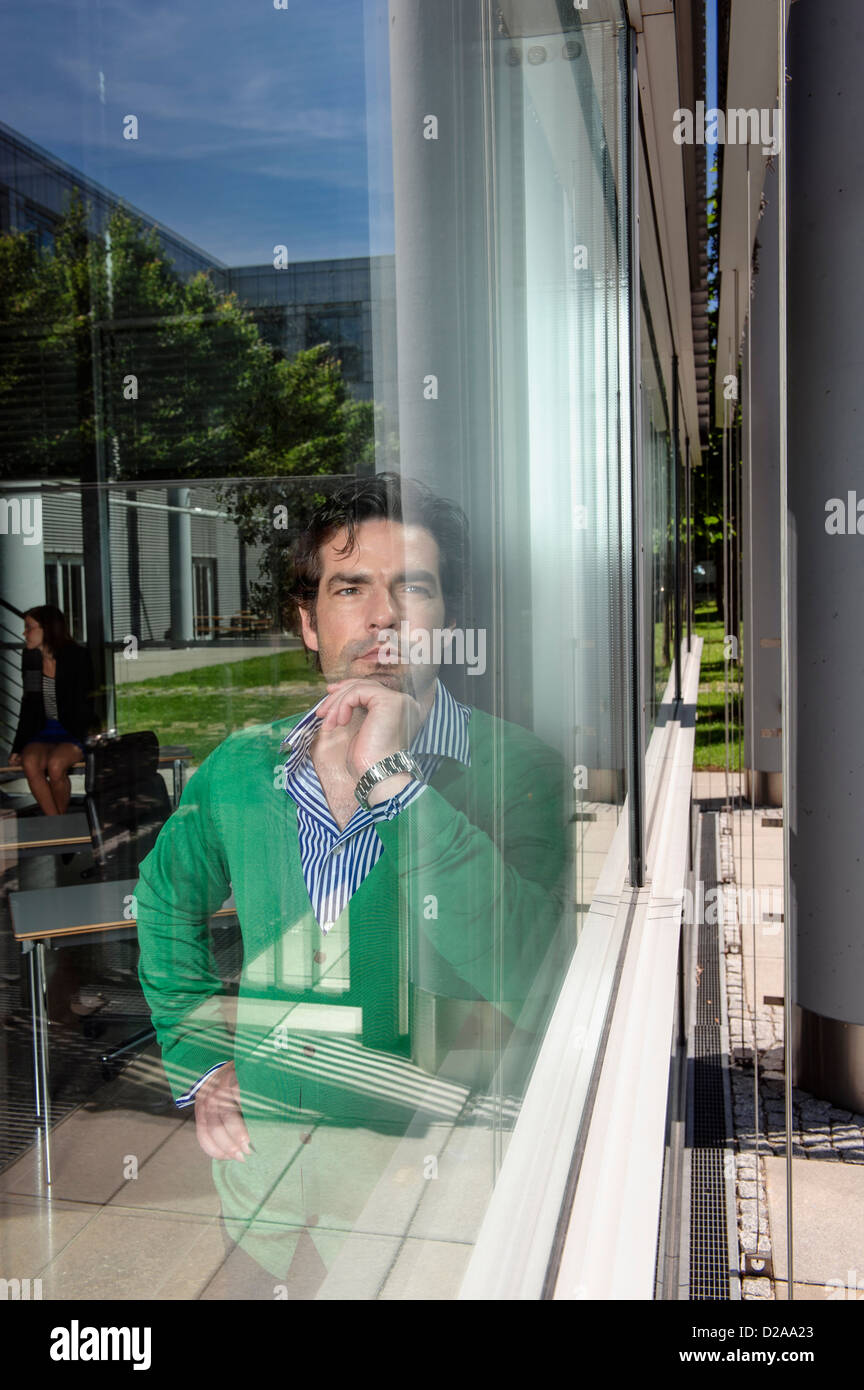 Woman behind window exterior hi-res stock photography and images - Alamy