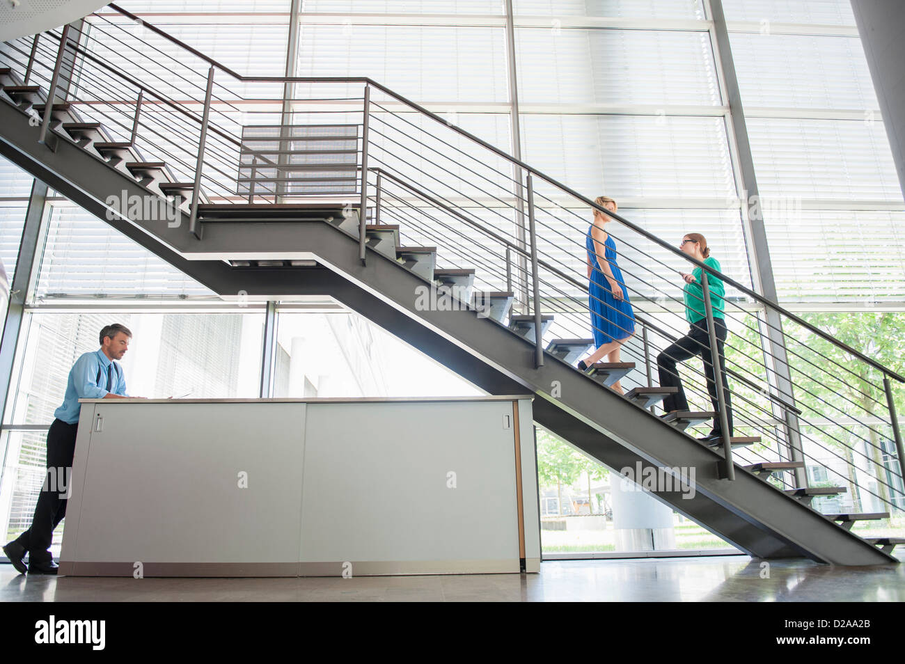 Businessman businesswoman busy staircase hi-res stock photography and ...