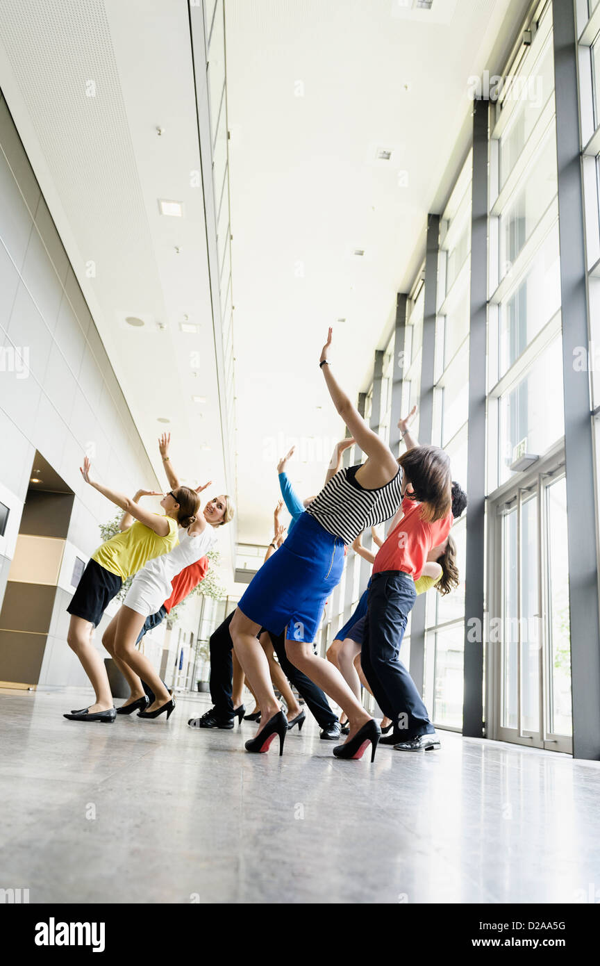 Business woman stretching up standing hi-res stock photography and ...