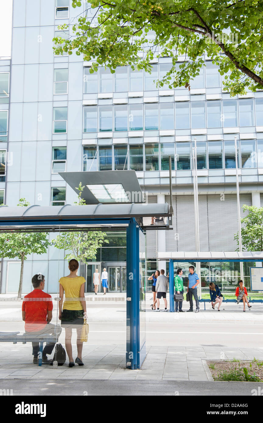 Bus Stop People Standing Stock Photos & Bus Stop People Standing Stock ...