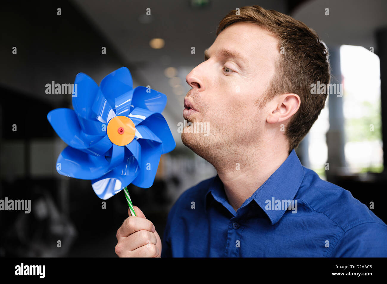 Man playing with pinwheel hi-res stock photography and images - Alamy