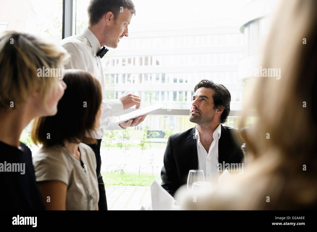Waiter taking businessmans order Stock Photo - Alamy Waiter taking businessmans order Stock Photo - Alamy
