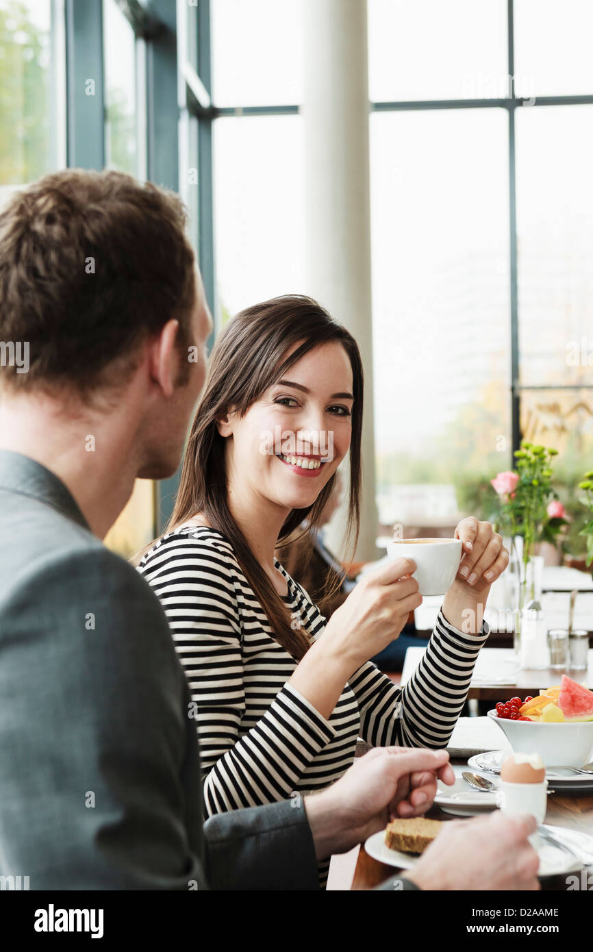 Couple having breakfast together†in cafe Stock Photo - Alamy