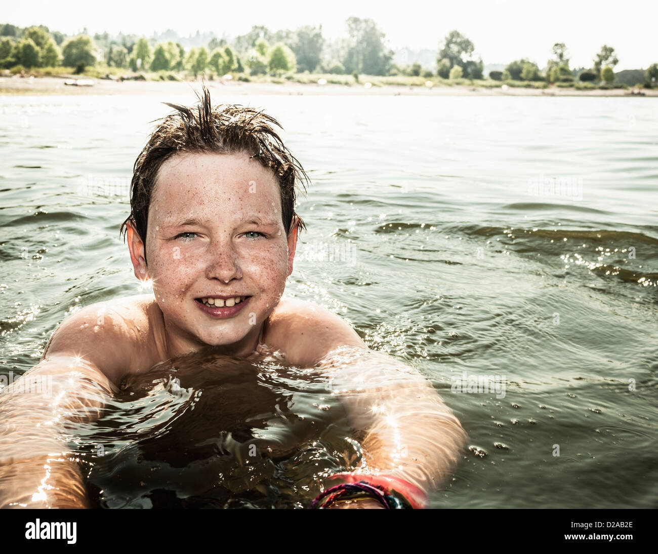Boy Swimming In Lake